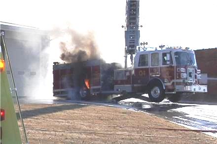 Aerial ladder into power line on ramp of Columbia, MO firehouse ...